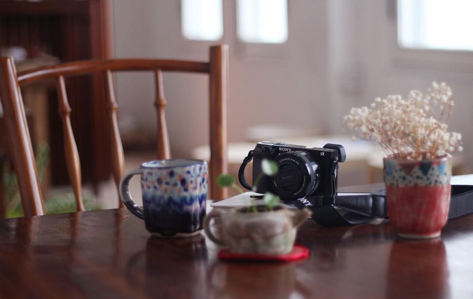 Free Stock Photo of Table With Camera and Two Mugs | Download Free ...