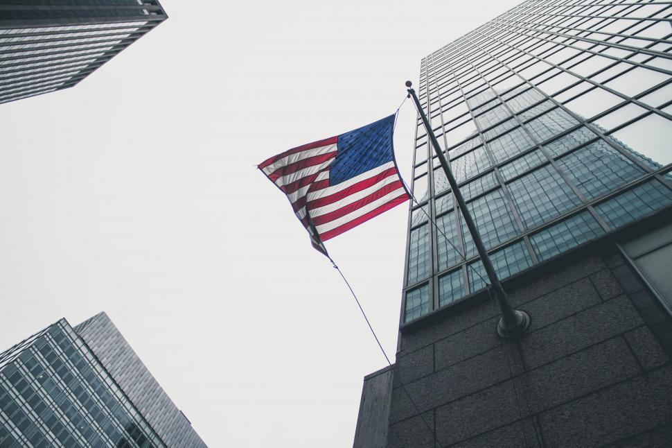 Free Stock Photo of American Flag Flying in Front of Tall Building ...