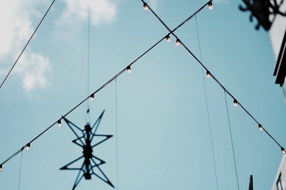 Free Stock Photo of String of Lights Hanging From Side of Building ...