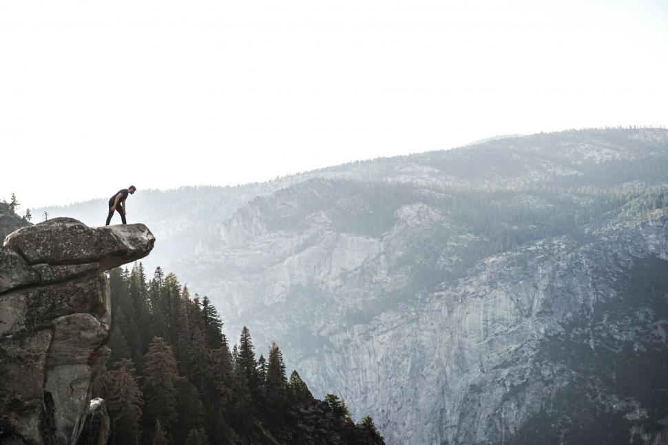 Free Stock Photo of Man Standing on Cliff Next to Forest | Download ...