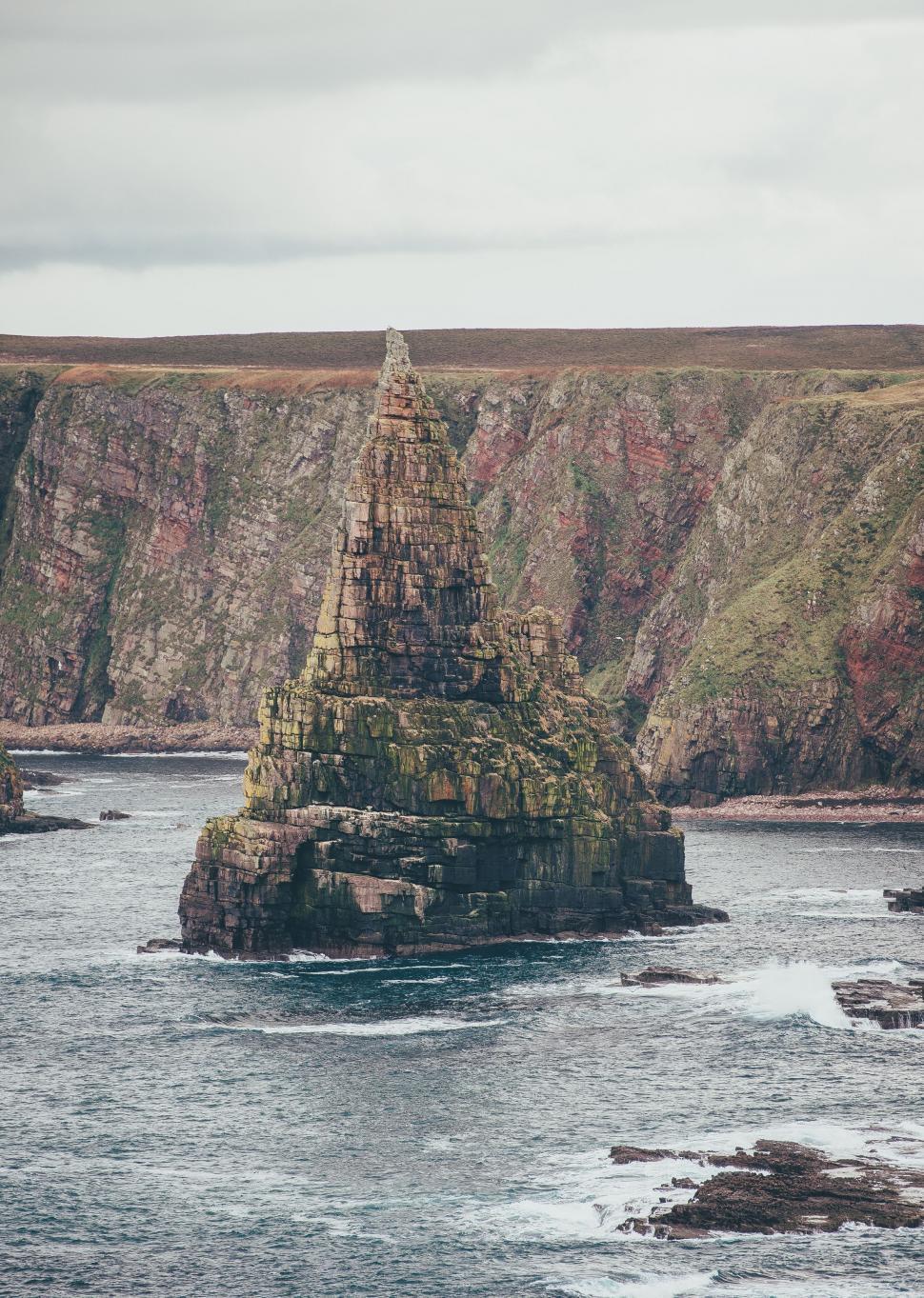 Free Stock Photo of Massive Rock Formation Emerging in Body of Water ...