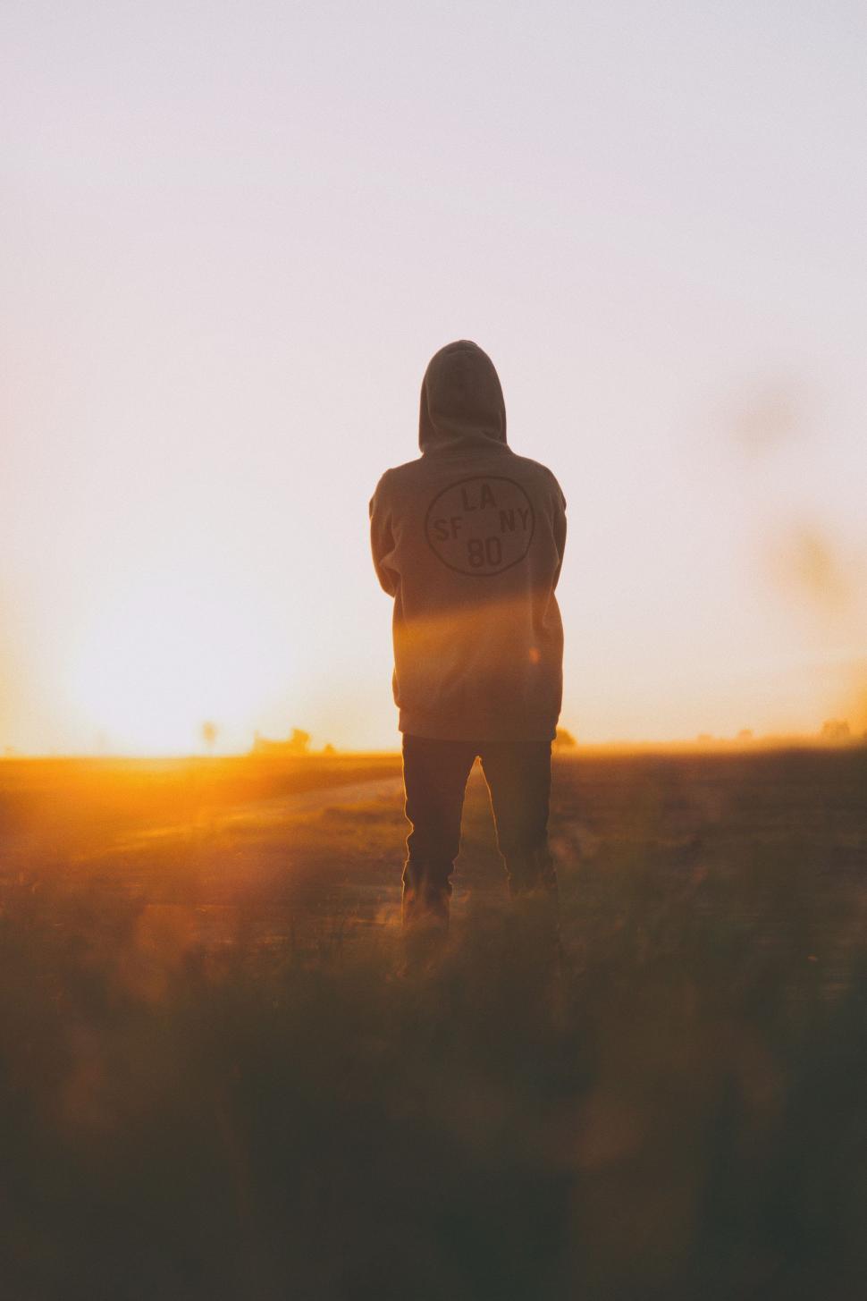 Free Stock Photo of Person Standing in Field at Sunset | Download Free ...