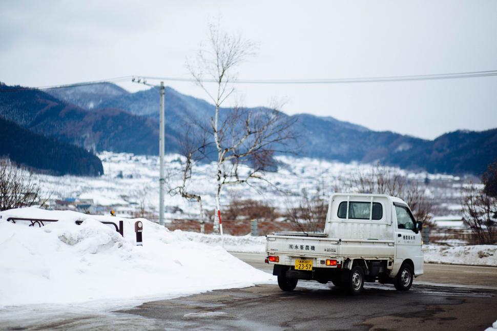 Free Stock Photo of White Truck Driving Down Snow Covered Road ...