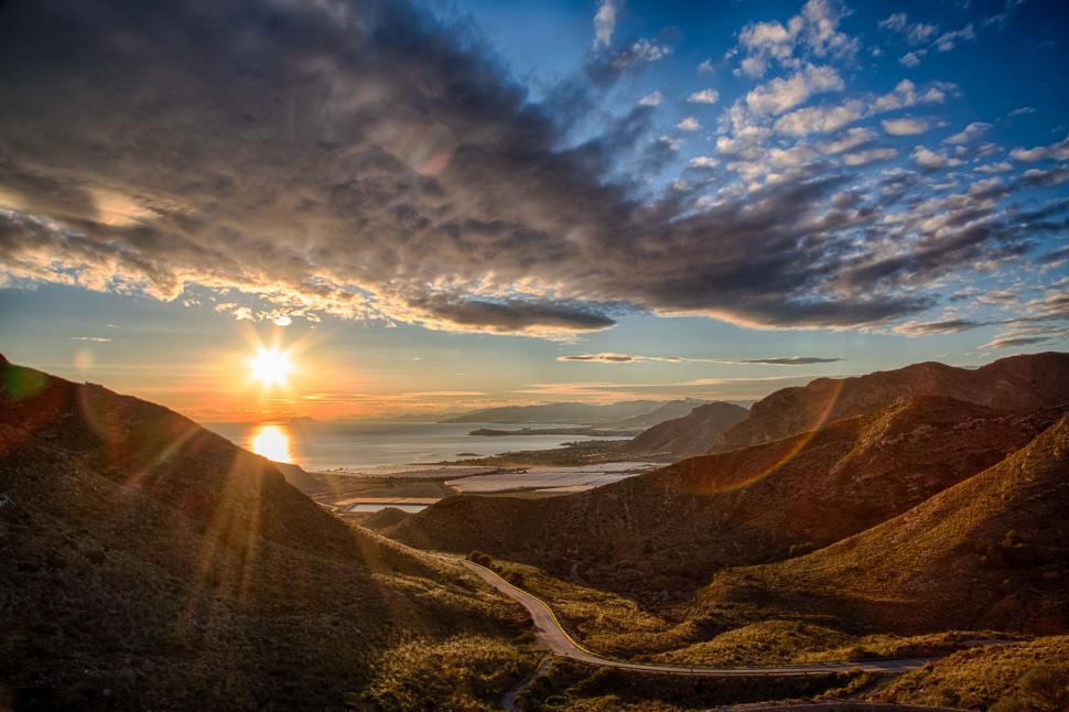 Free Stock Photo of Sun Setting Over Mountains and Road | Download Free ...
