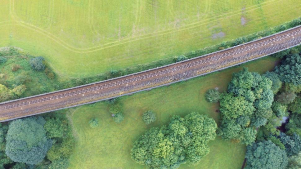 Free Stock Photo of Aerial View of Train Track in Green Field ...