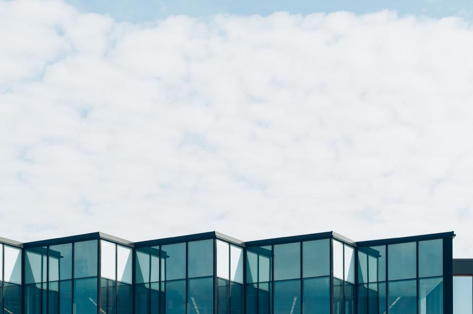 Free Stock Photo of Row of Glass Buildings Against Sky Background ...