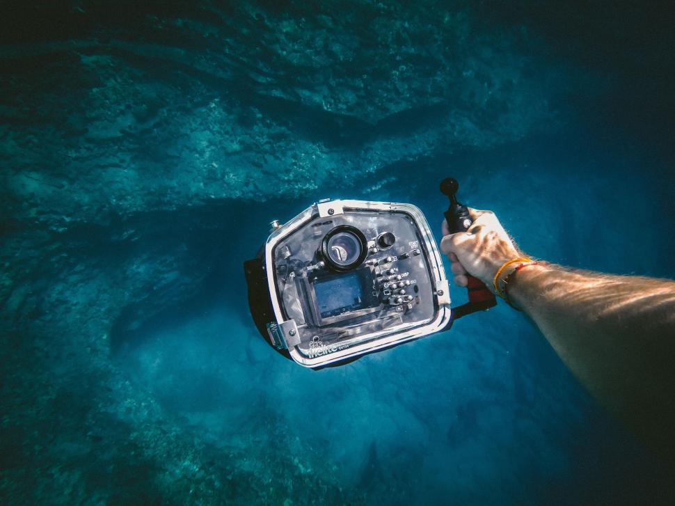 Free Stock Photo of Hand Holding Camera Over Body of Water | Download ...