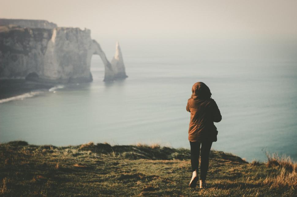Free Stock Photo of Person Standing on Hill Overlooking Body of Water ...