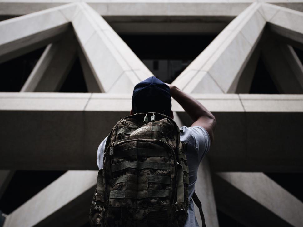 Free Stock Photo of Person With Backpack Standing in Front of Building ...