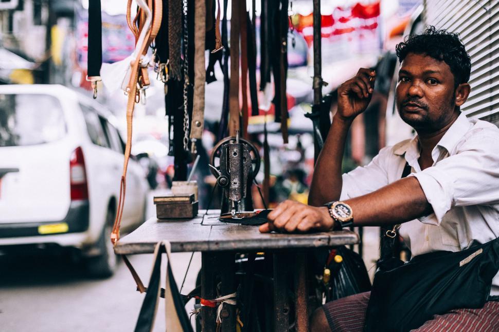 Free Stock Photo of Man Working on Sewing Machine at Table | Download ...