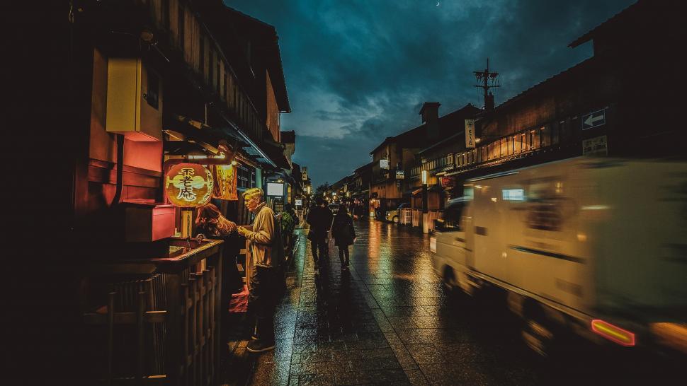 Free Stock Photo of Group of People Walking Down a City Street at Night ...
