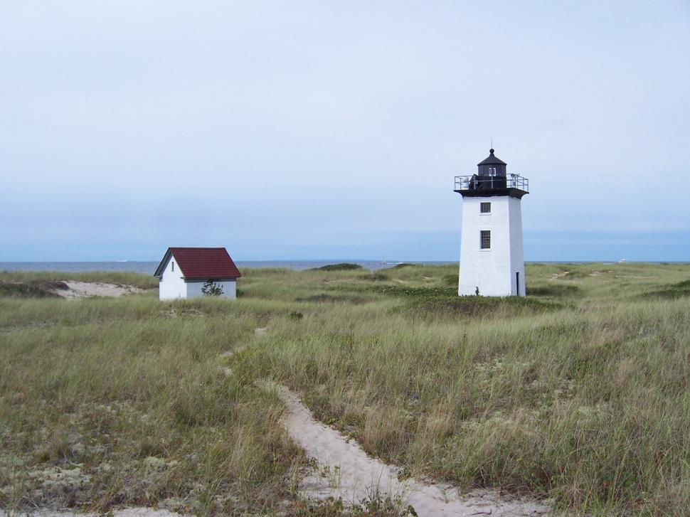 Free Stock Photo of Lighthouse Standing in Grassy Field | Download Free ...