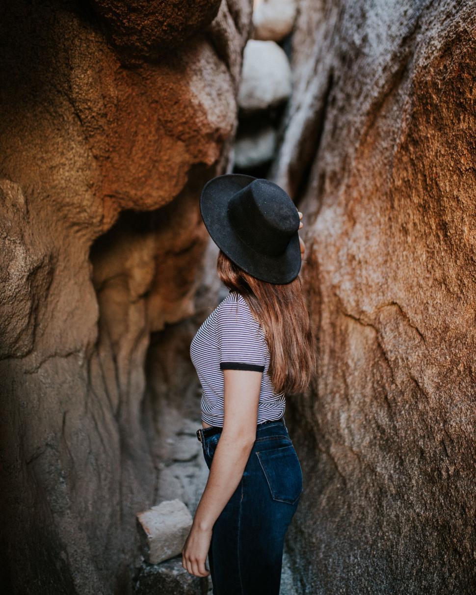 Free Stock Photo of Woman Wearing Hat Standing in Cave | Download Free ...