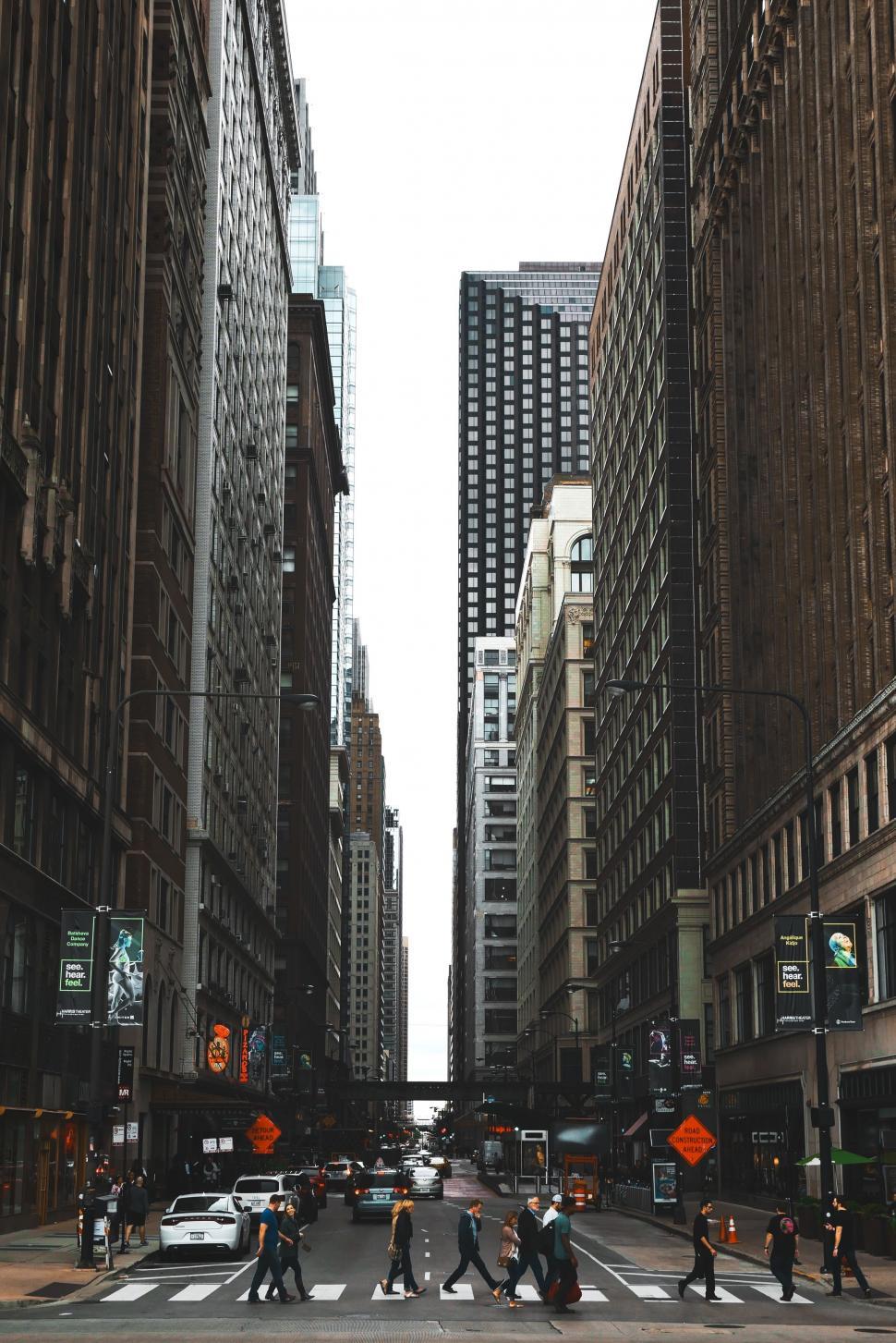 Free Stock Photo of Group of People Crossing Street in Front of Tall ...