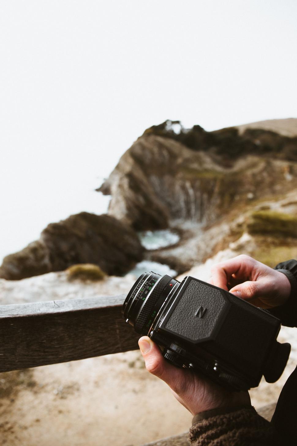 Free Stock Photo of Person Holding Camera by Water | Download Free ...