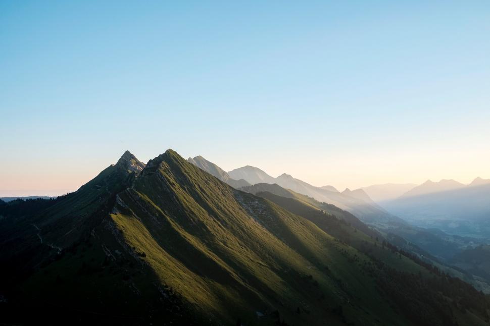 Free Stock Photo of A View of the Top of a Mountain at Sunset ...