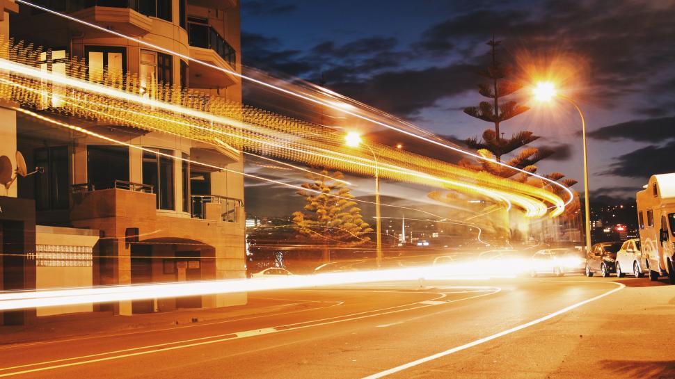 Free Stock Photo of Bus Driving Down Street Next to Tall Building ...