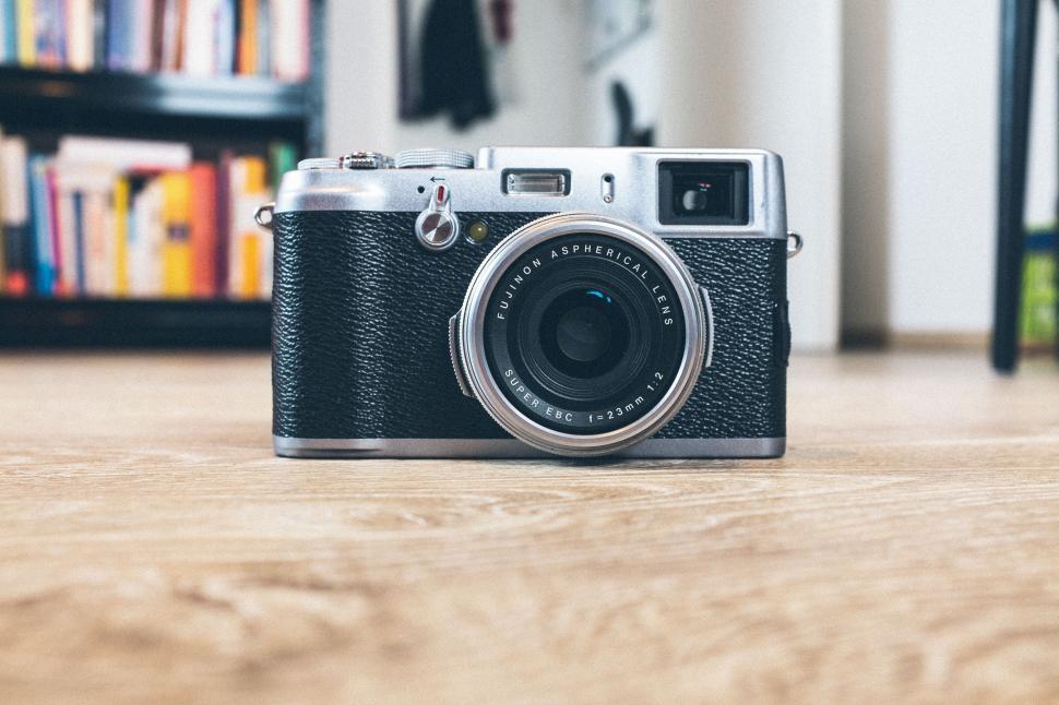 Free Stock Photo of Camera on Floor in Front of Bookshelf | Download ...