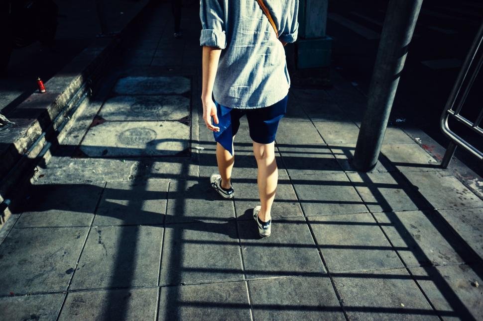 Free Stock Photo of Man Walking Down Sidewalk Next to Building ...