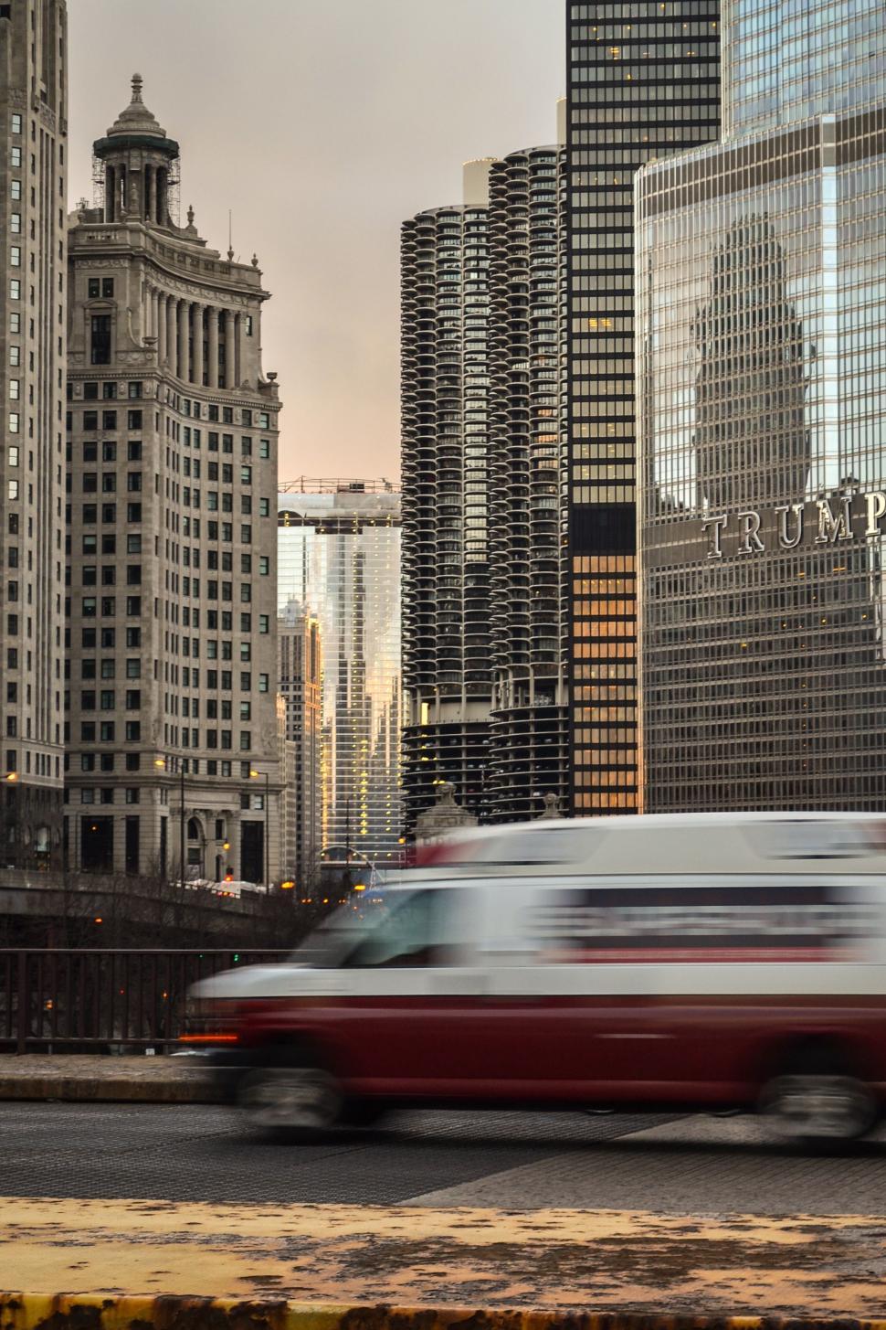 Free Stock Photo of Red Car Driving Down Busy City Street | Download ...