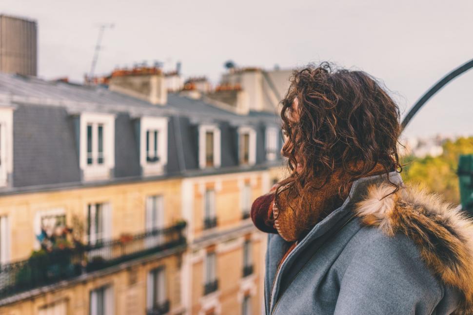 Free Stock Photo of Woman Standing on Balcony Looking at Building ...