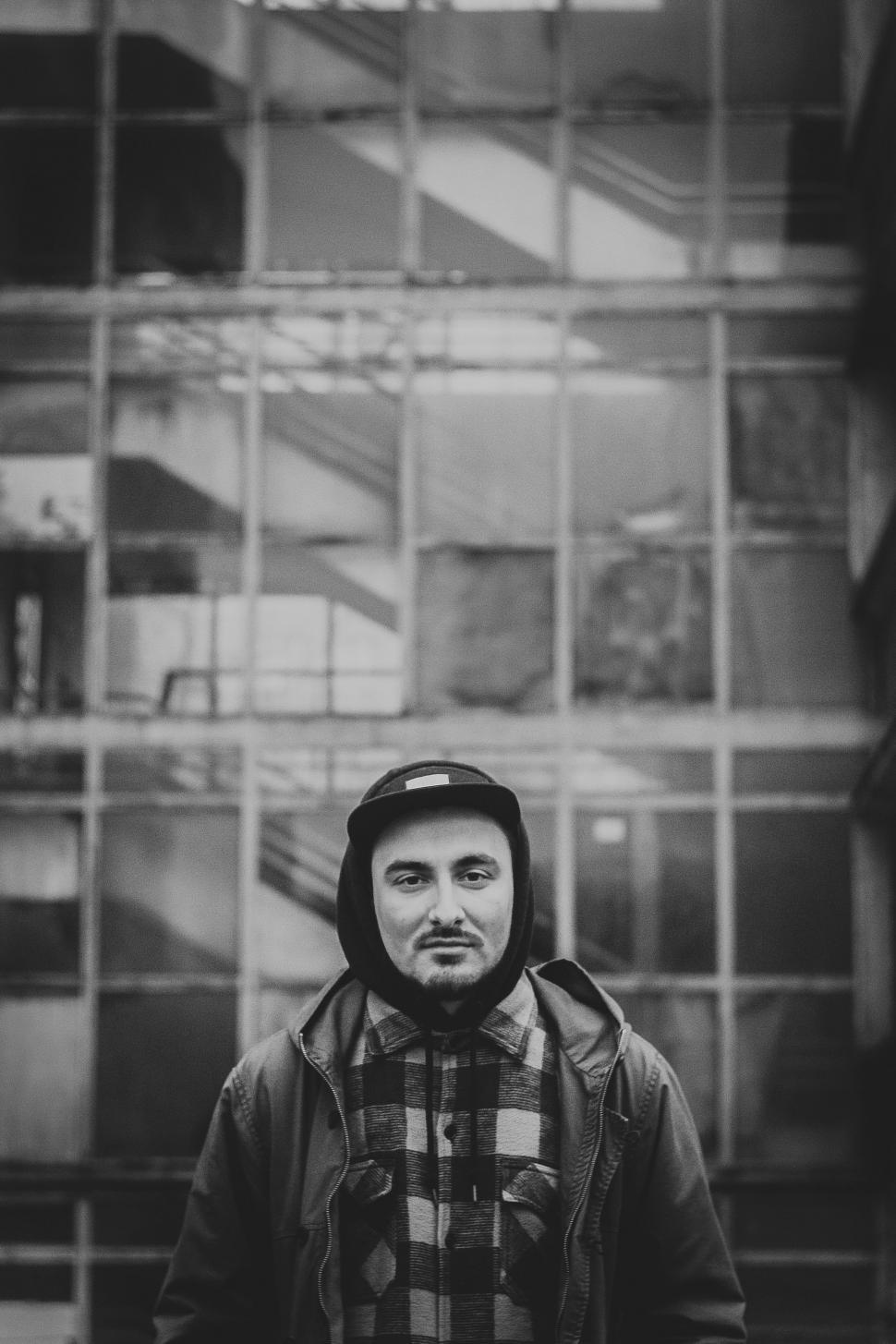 Free Stock Photo of Man Standing in Front of Tall Building | Download ...