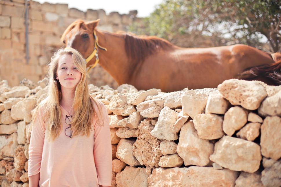 Free Stock Photo of A teenage blonde girl standing outside a horse ...