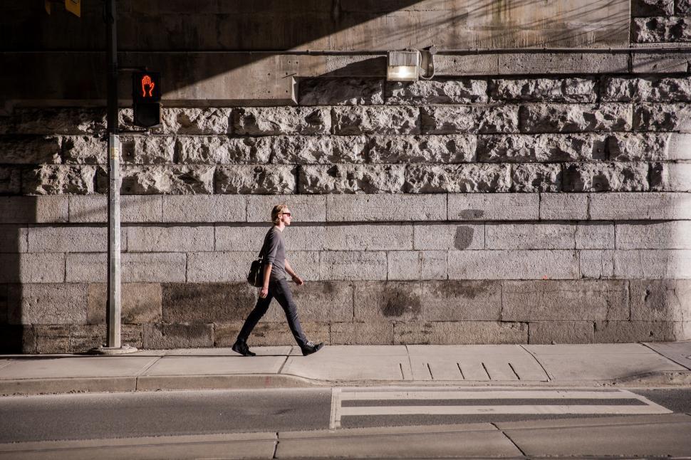 Free Stock Photo of A young caucasian man walking in urban sunlight ...