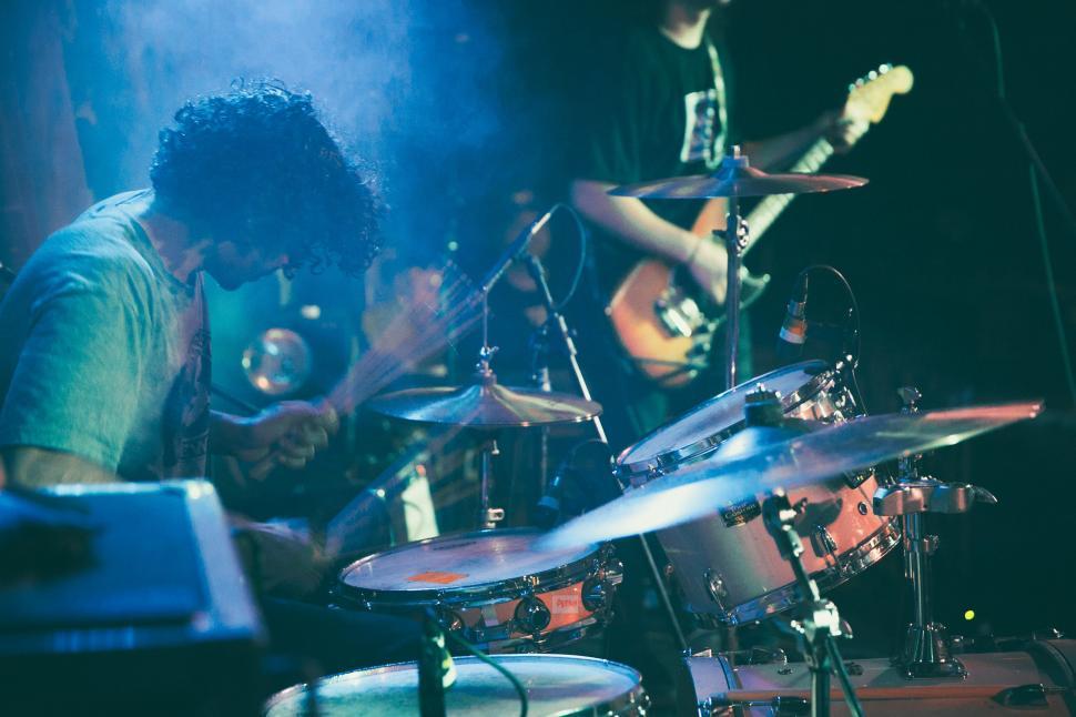 Free Stock Photo of A drummer playing along with a guitarist in a ...