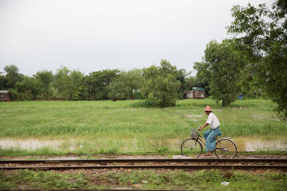 Free Stock Photo of A man riding a bicycle near train tracks | Download ...