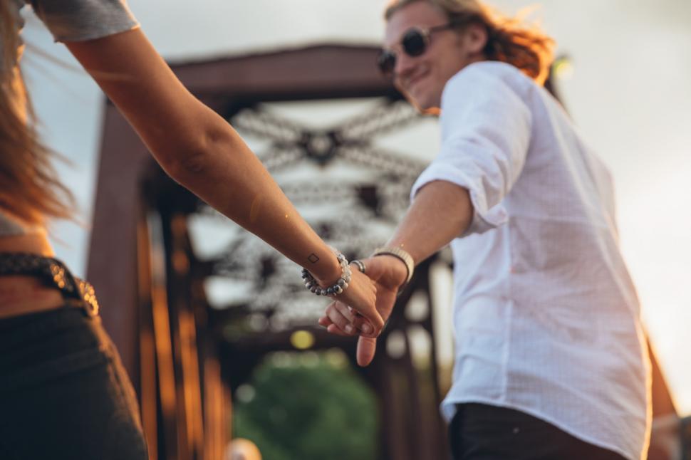 Free Stock Photo of A caucasian couple holding each others hands ...