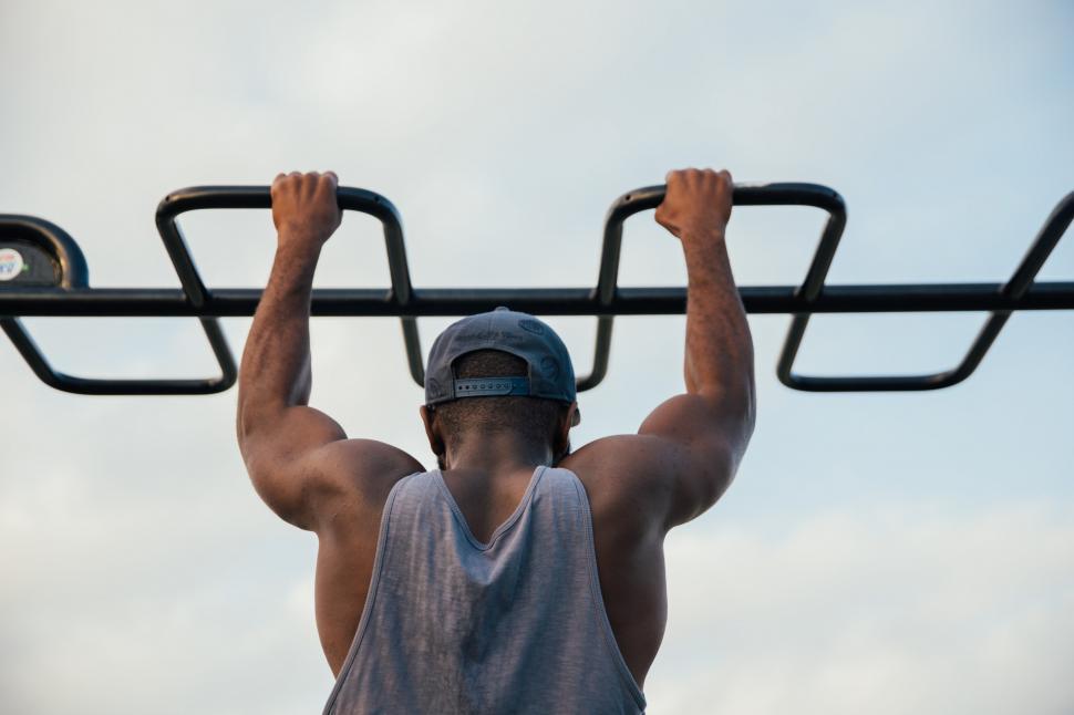 Free Stock Photo of A young african man doing chin-up exercise ...