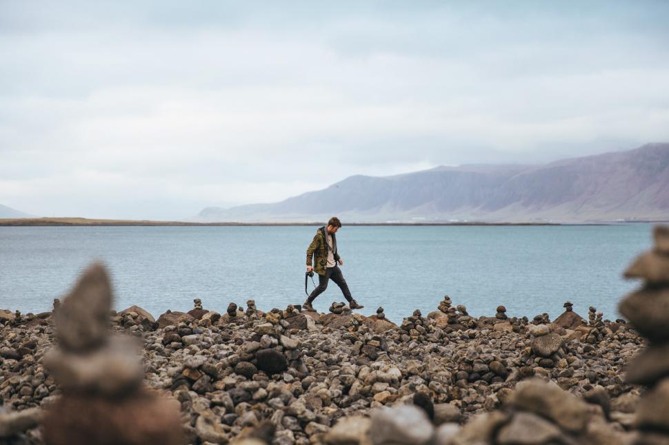 Free Stock Photo of A young hiker on a stoney shore | Download Free ...