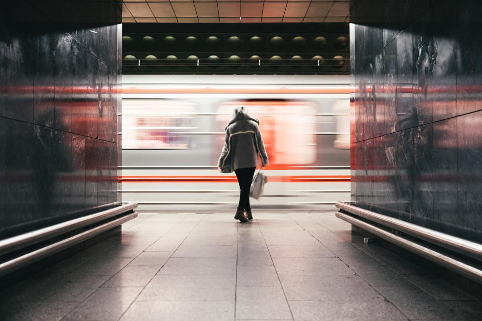 Free Stock Photo of A woman in hooded jacket waits for the train ...