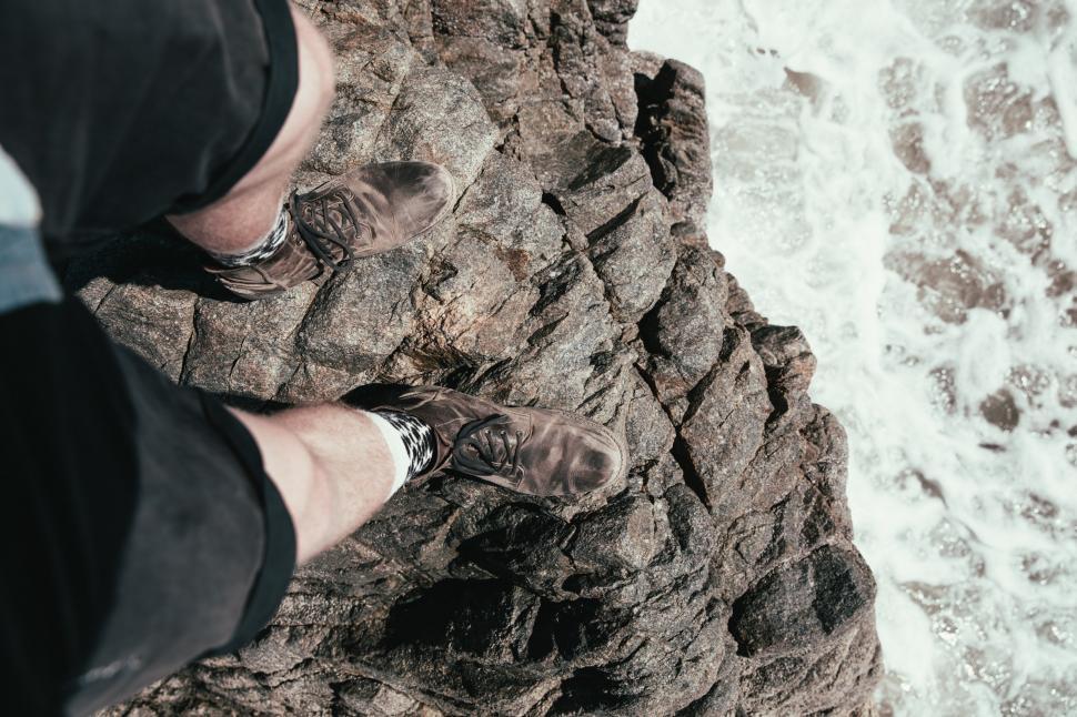 Free Stock Photo of Feet hanging over the edge of a rock | Download ...