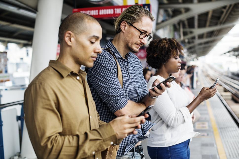 Free Stock Photo of Multiethnicity Commuters looking at their mobile ...