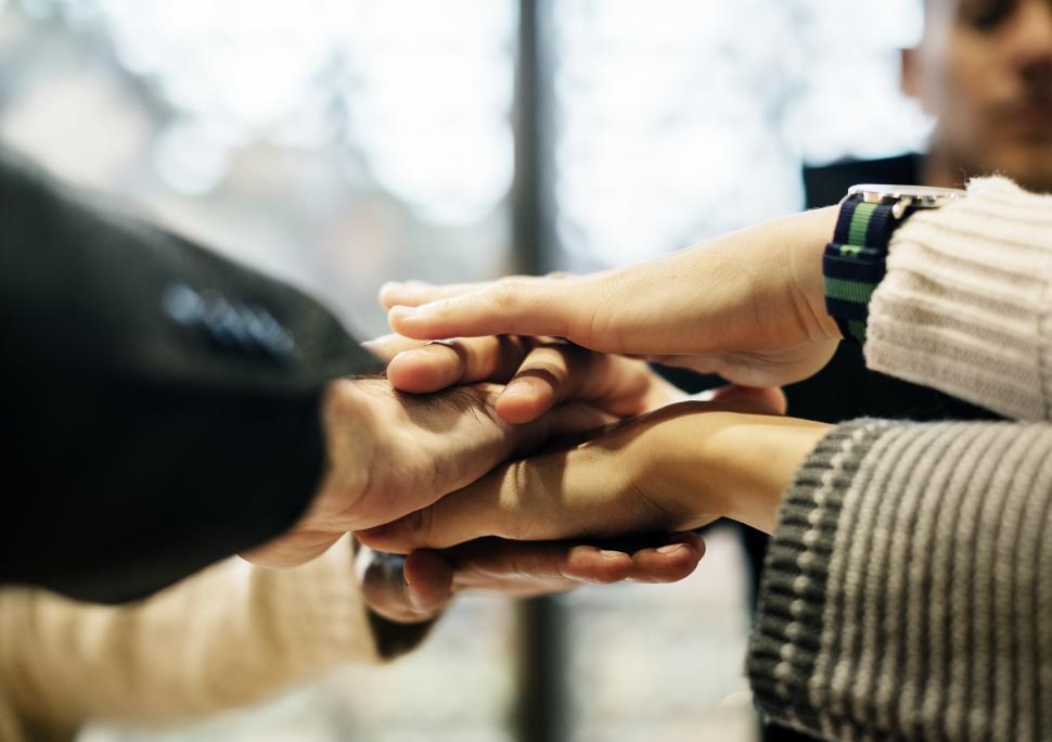 Free Stock Photo of Hands of team stacked together in a meeting ...