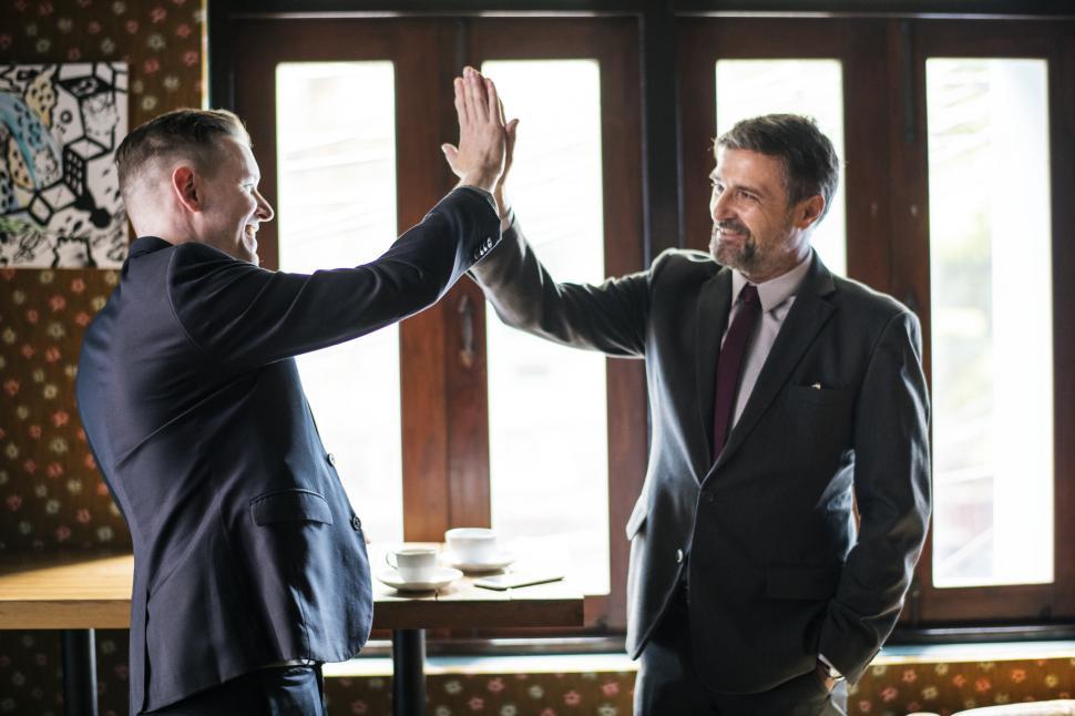 Free Stock Photo of Businessmen coworkers giving high five in the ...