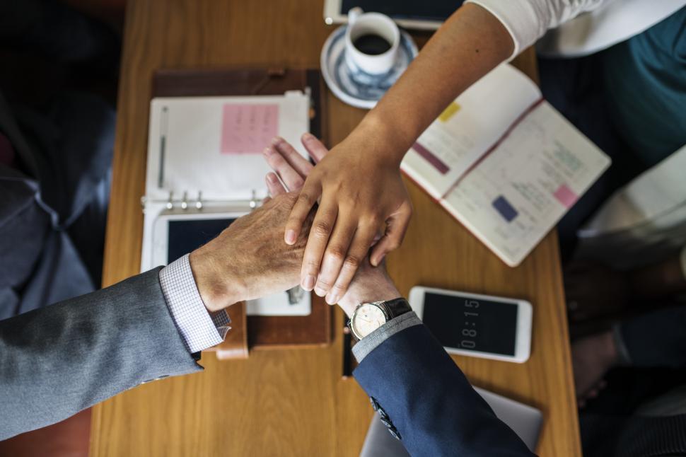 Free Stock Photo of Three hands stacked together after a meeting ...