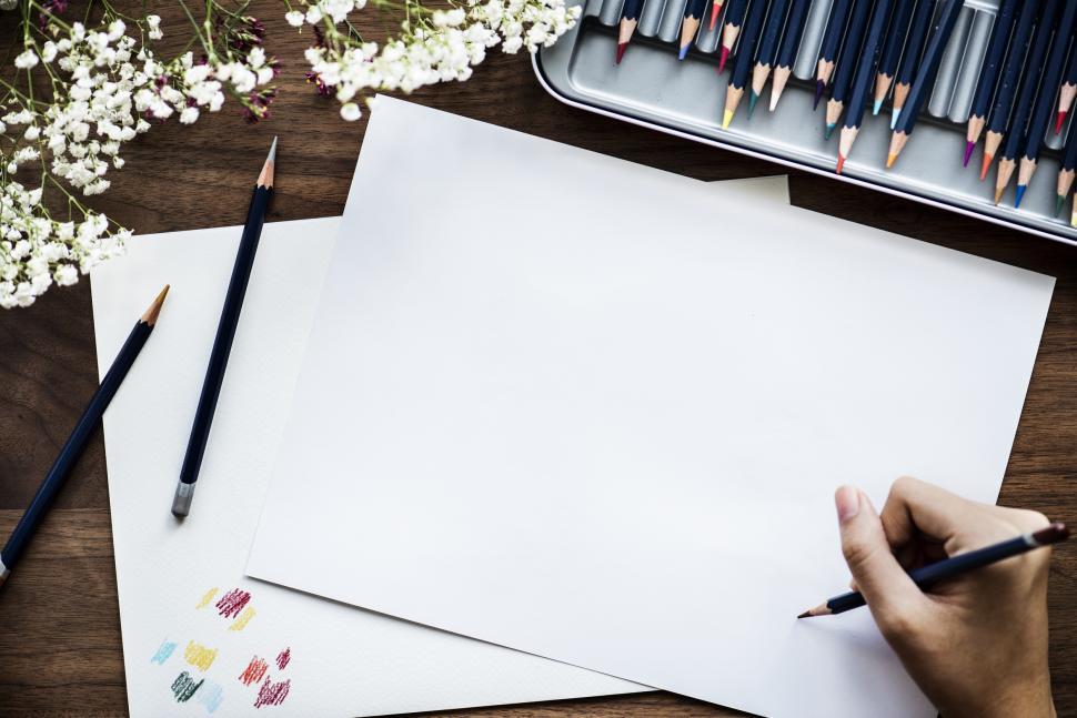 Free Stock Photo of Overhead view of a hand drawing on white paper ...