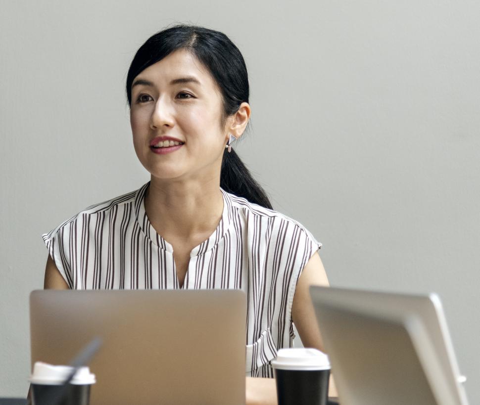 Free Stock Photo of Young woman at computer in group meeting | Download ...