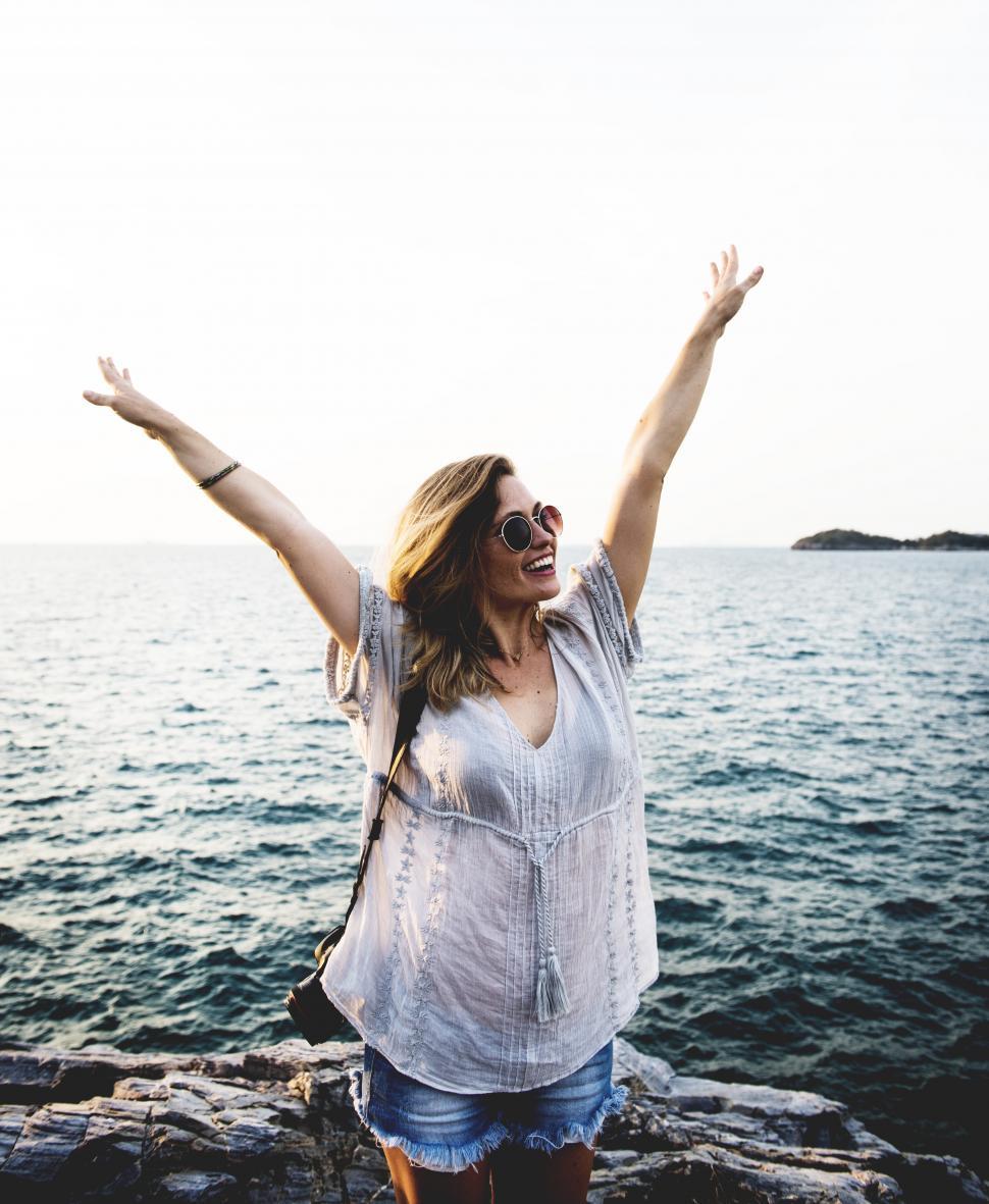 Free Stock Photo of A young Caucasian woman wading in the ocean ...