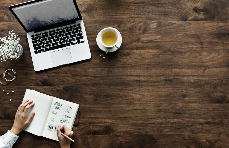 Free Stock Photo of Overhead view of hands writing on a notebook ...