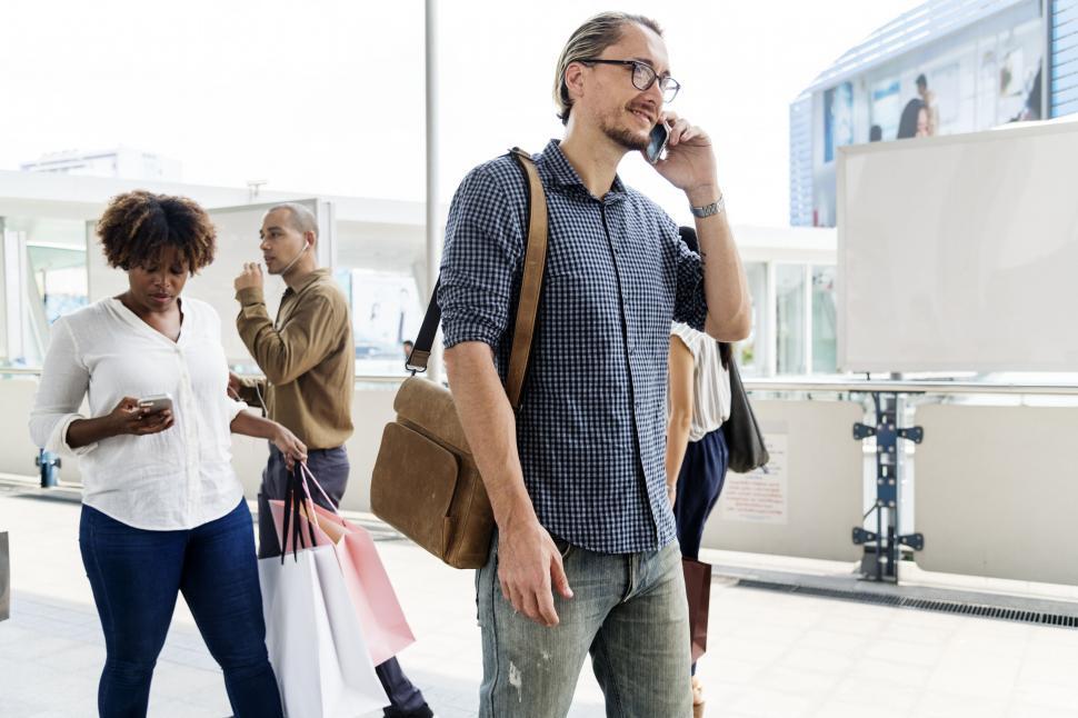Free Stock Photo of A man speaking on his mobile phone outside on ...