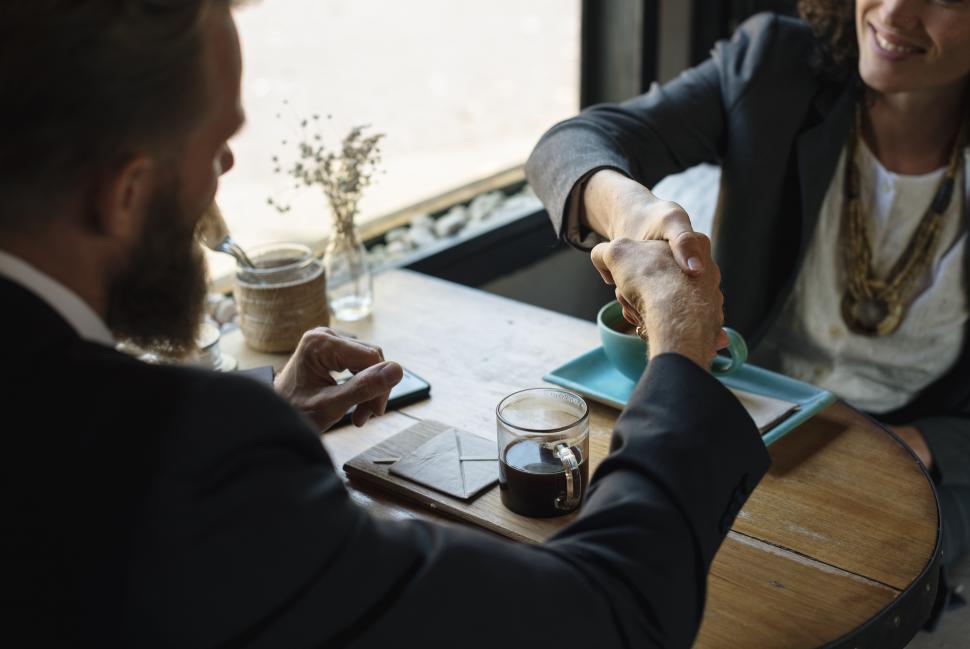 Free Stock Photo of Handshake between two business people over a drink ...