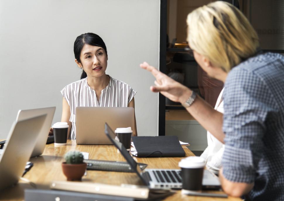 Free Stock Photo of Two colleagues in discussions at the office ...