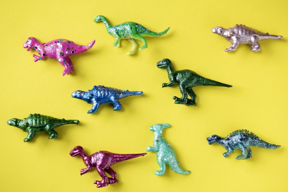 Free Stock Photo of Colorful toy dinosaurs on yellow surface | Download ...