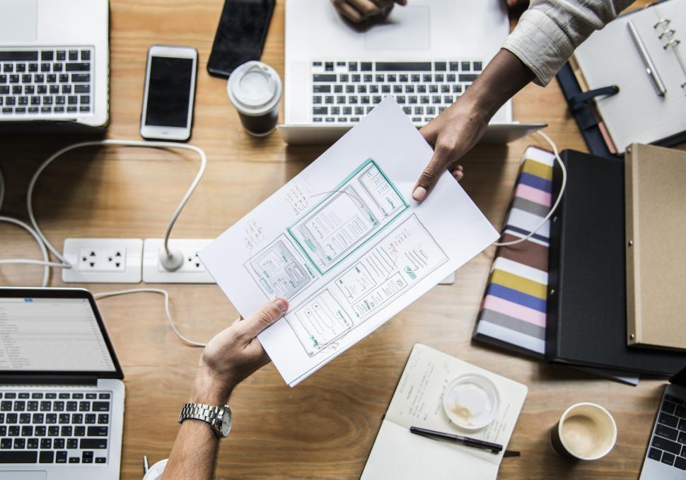 Free Stock Photo of Overhead view a design wireframe being shared ...