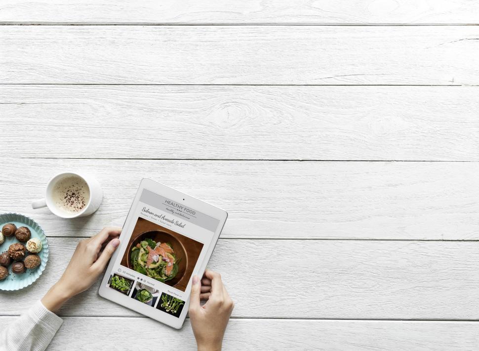 Free Stock Photo of Overhead view of a hand holding a tablet PC, with ...