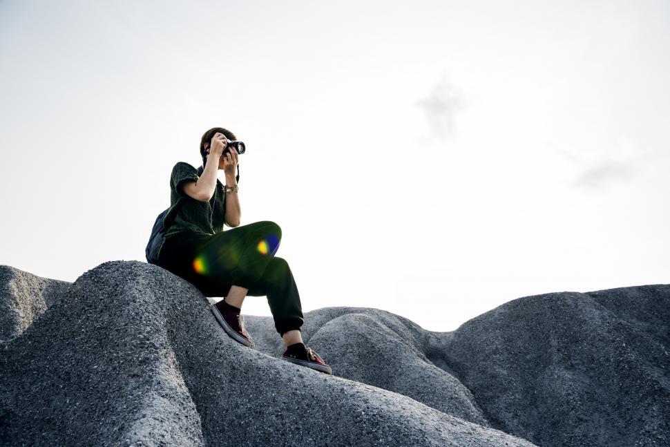 Free Stock Photo of A young caucasian woman taking photo on a bumpy ...